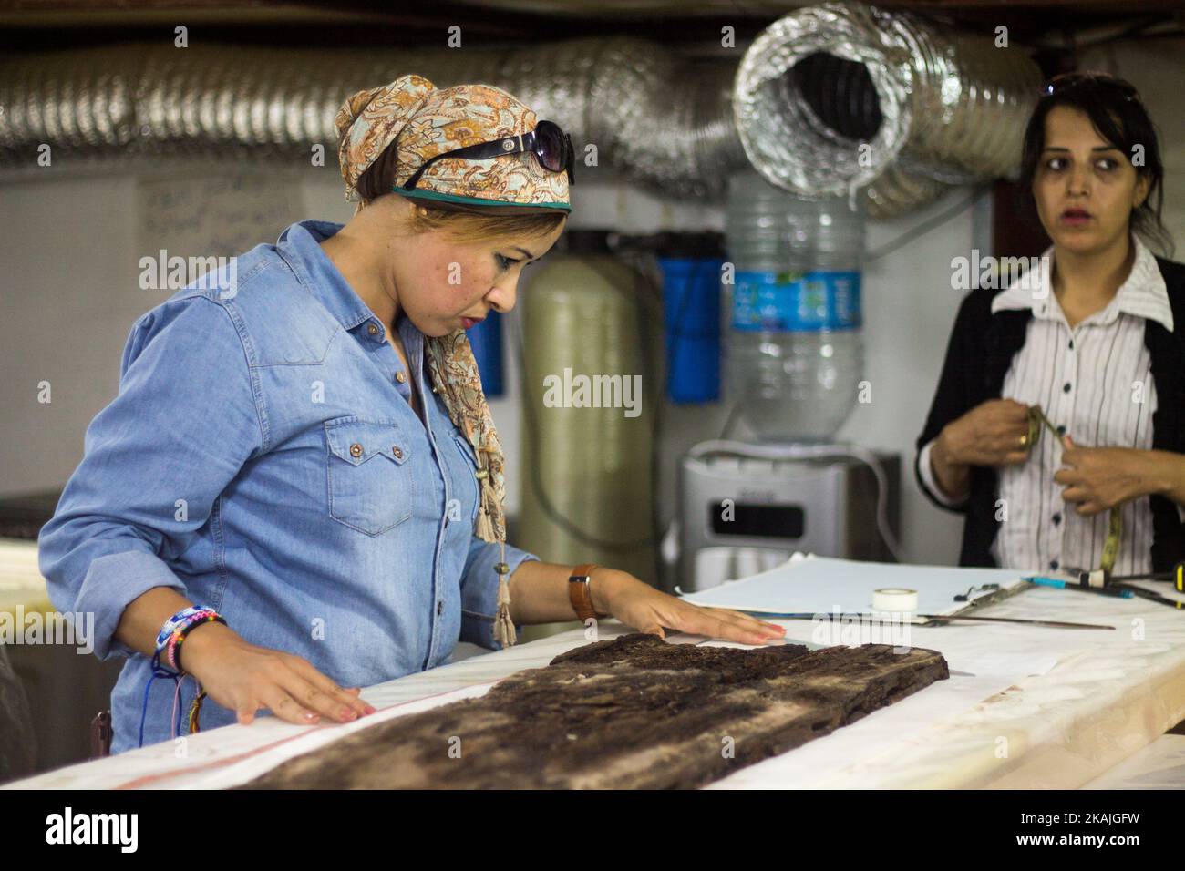 Archeologist look at parts of the second solar boat of Pharaoh Khufu on ...