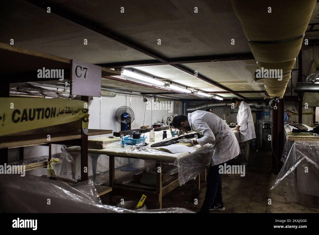 Archeologist look at parts of the second solar boat of Pharaoh Khufu on ...