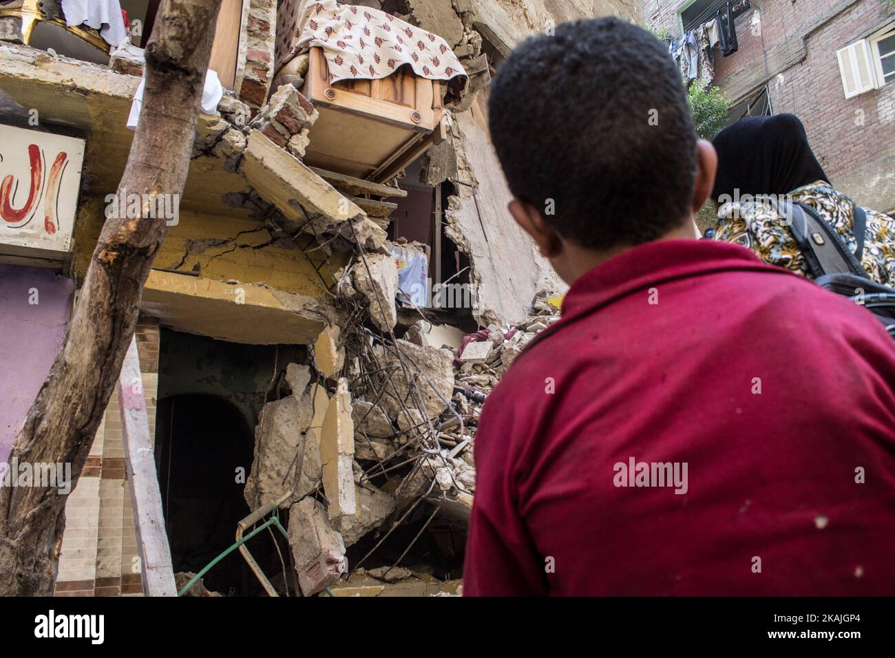 People attend the search and rescue operation for the Residential ...