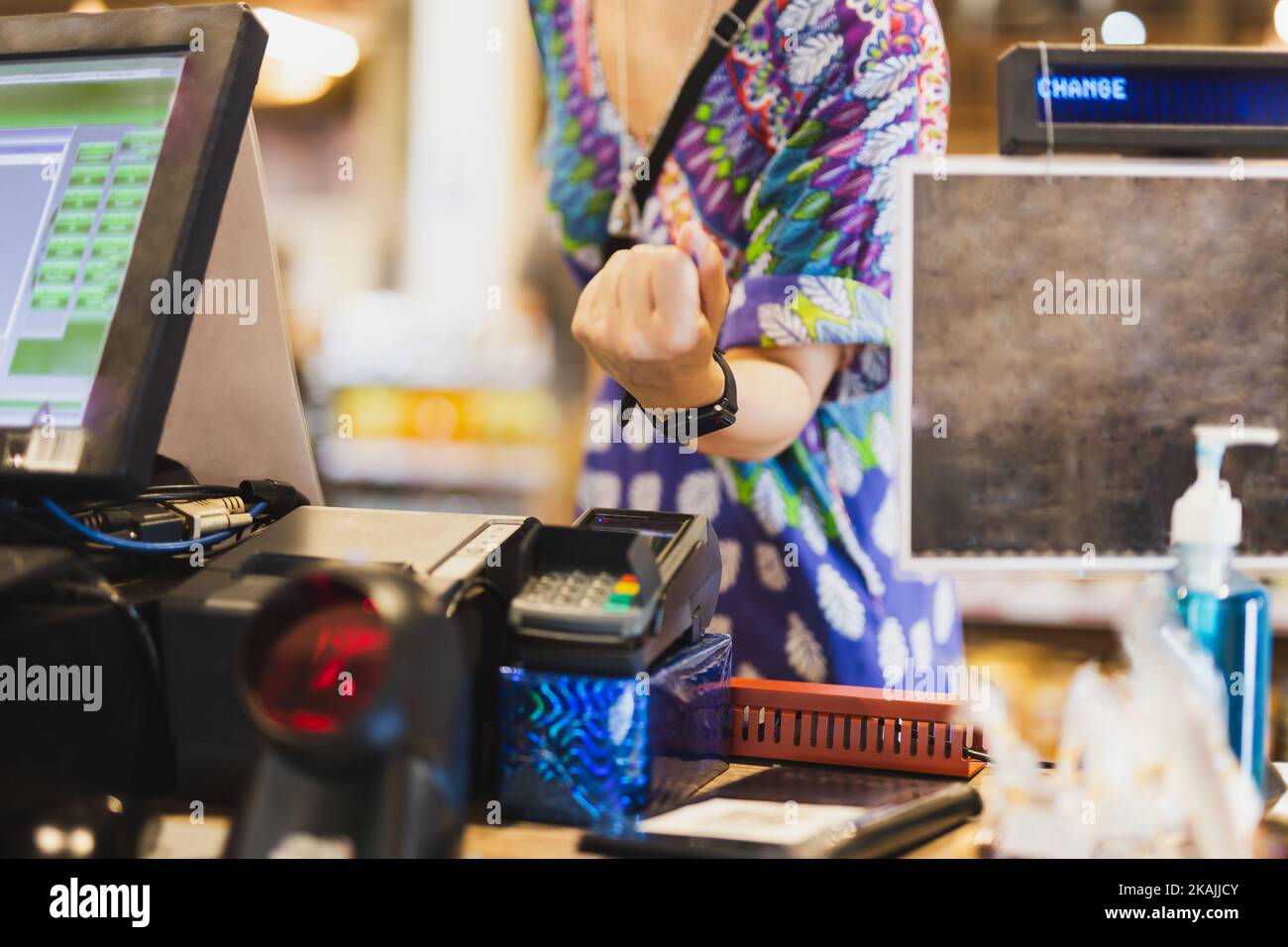 Customer payment smart wallet via smart watch terminal Stock Photo - Alamy