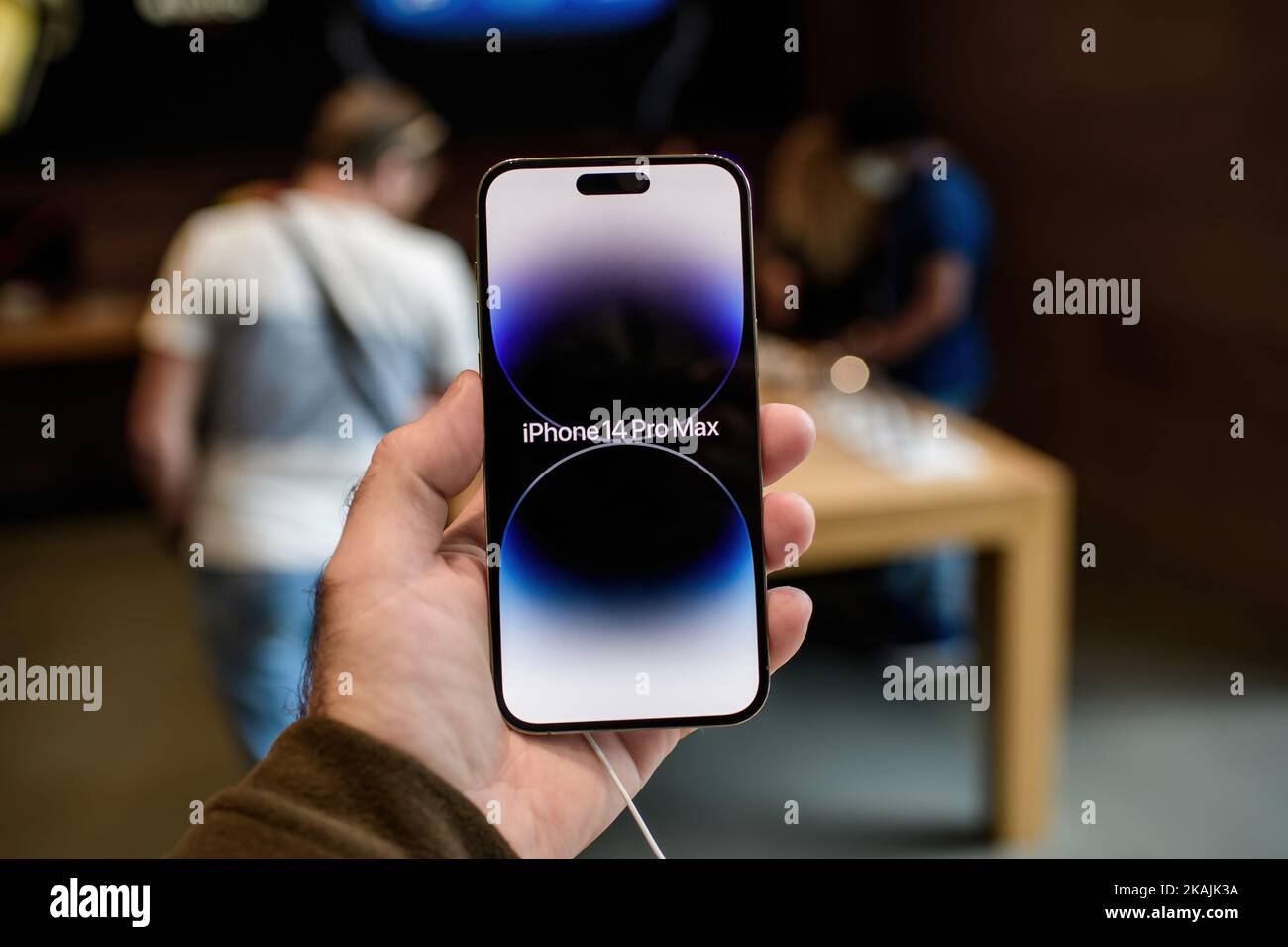 Paris, France - Oct 28, 2022: Front view of new Apple Computers iPhone 14 pro - defocused blur ...