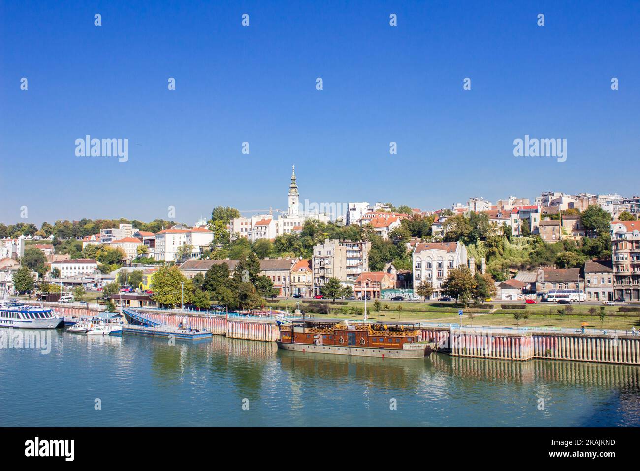 A scenic view of the port in Belgradewith large boats and the ...