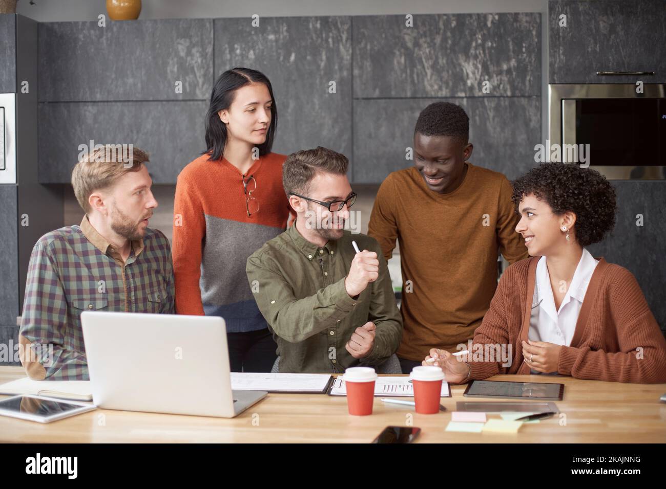 business man explaining something to his colleagues Stock Photo - Alamy