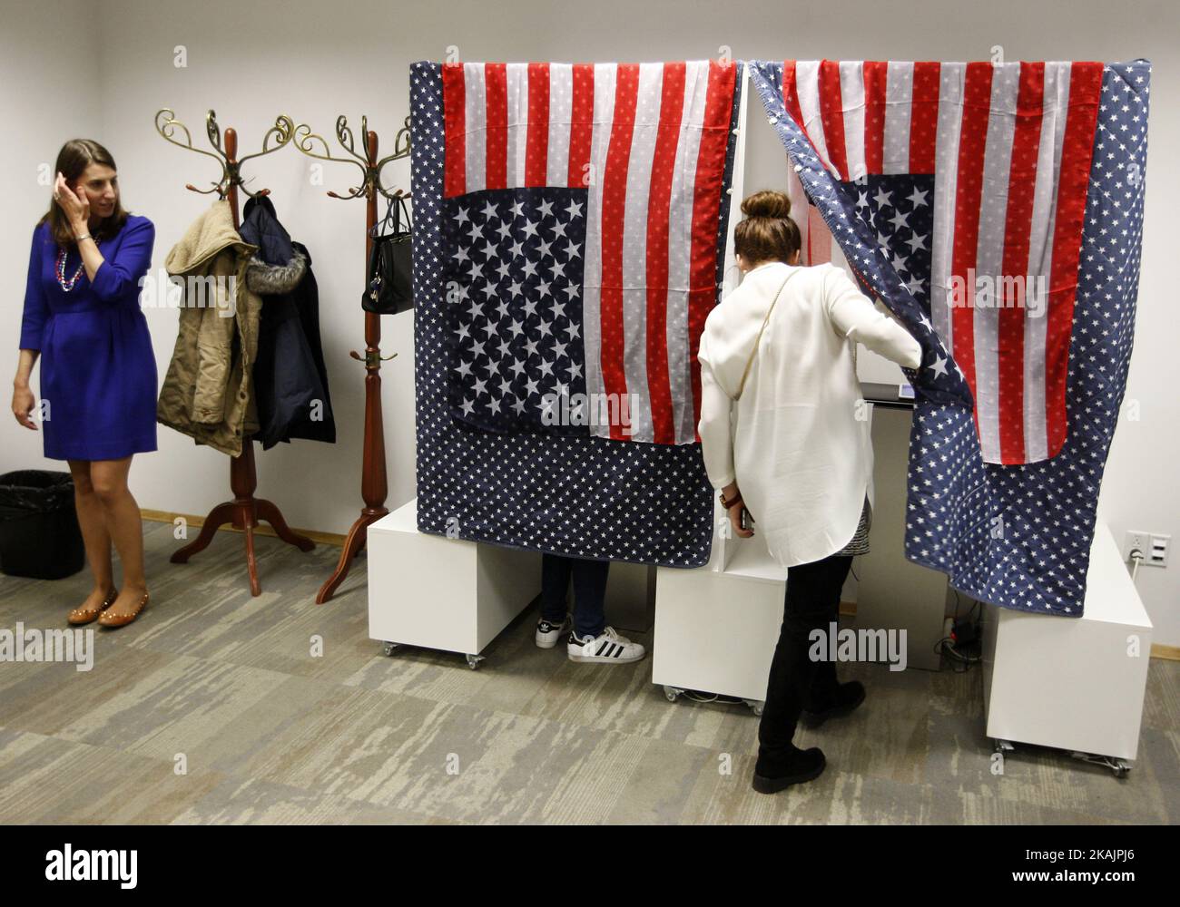 A woman enters inside a mock voting booth,for mock voting at America ...