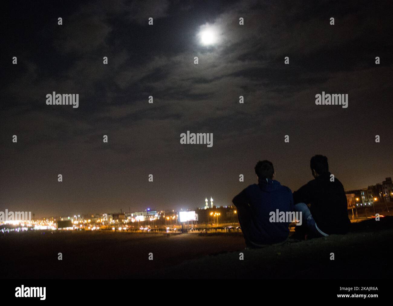 People watch the supermoon in Cairo, Egypt, on November 14, 2016. The ...