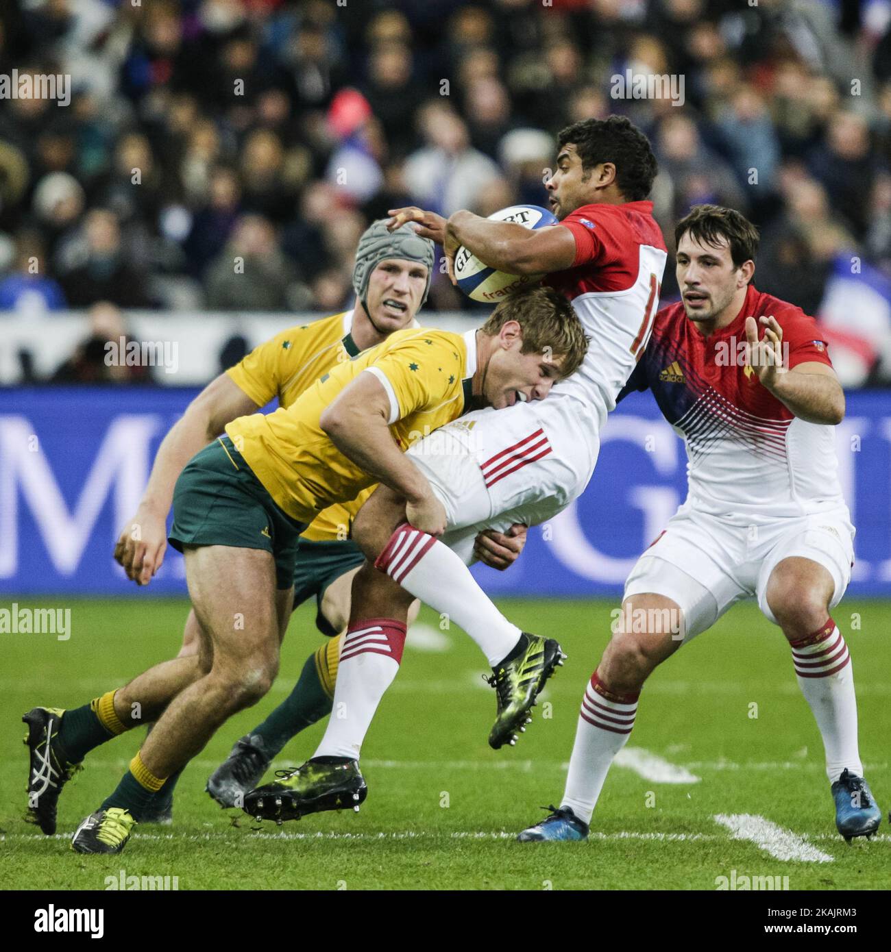 France's centre Wesley Fofana is tackled by Australia's inside centre ...
