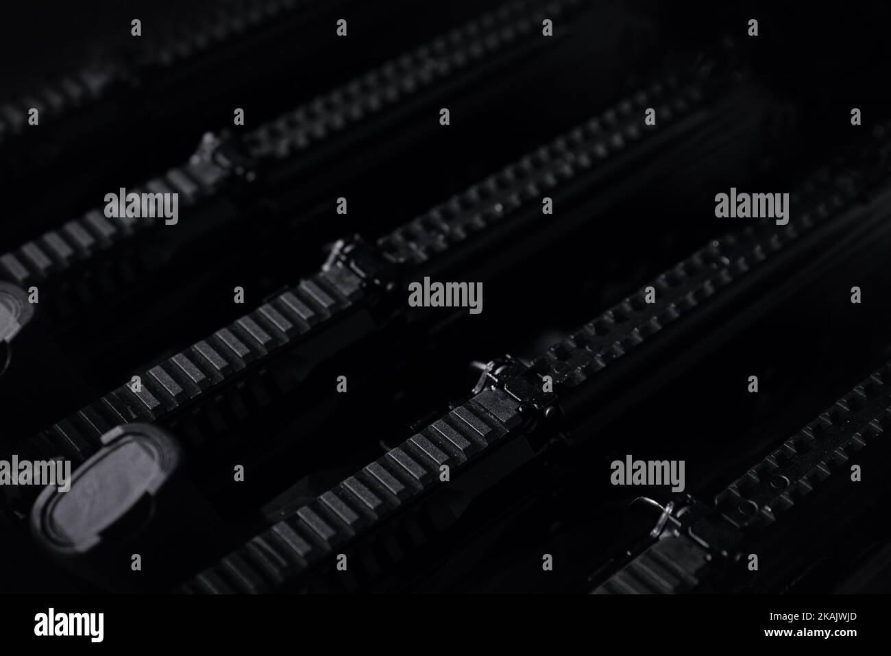 Picatinny bars on new automatic rifles in a box. The sighting bar of an ...