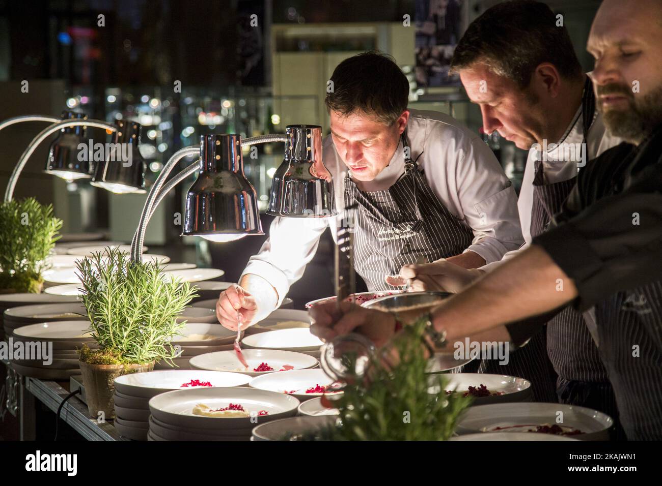 Chefs are pictured during the preparation of the gala dinner organized ...