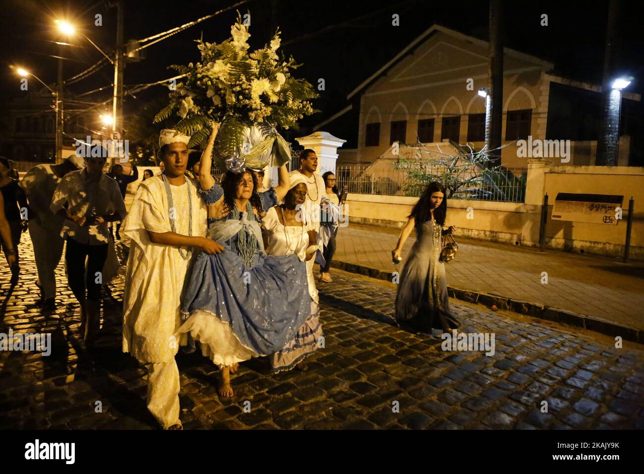 Members of the Afro-Brazilian ritual take to the sea an offering of ...