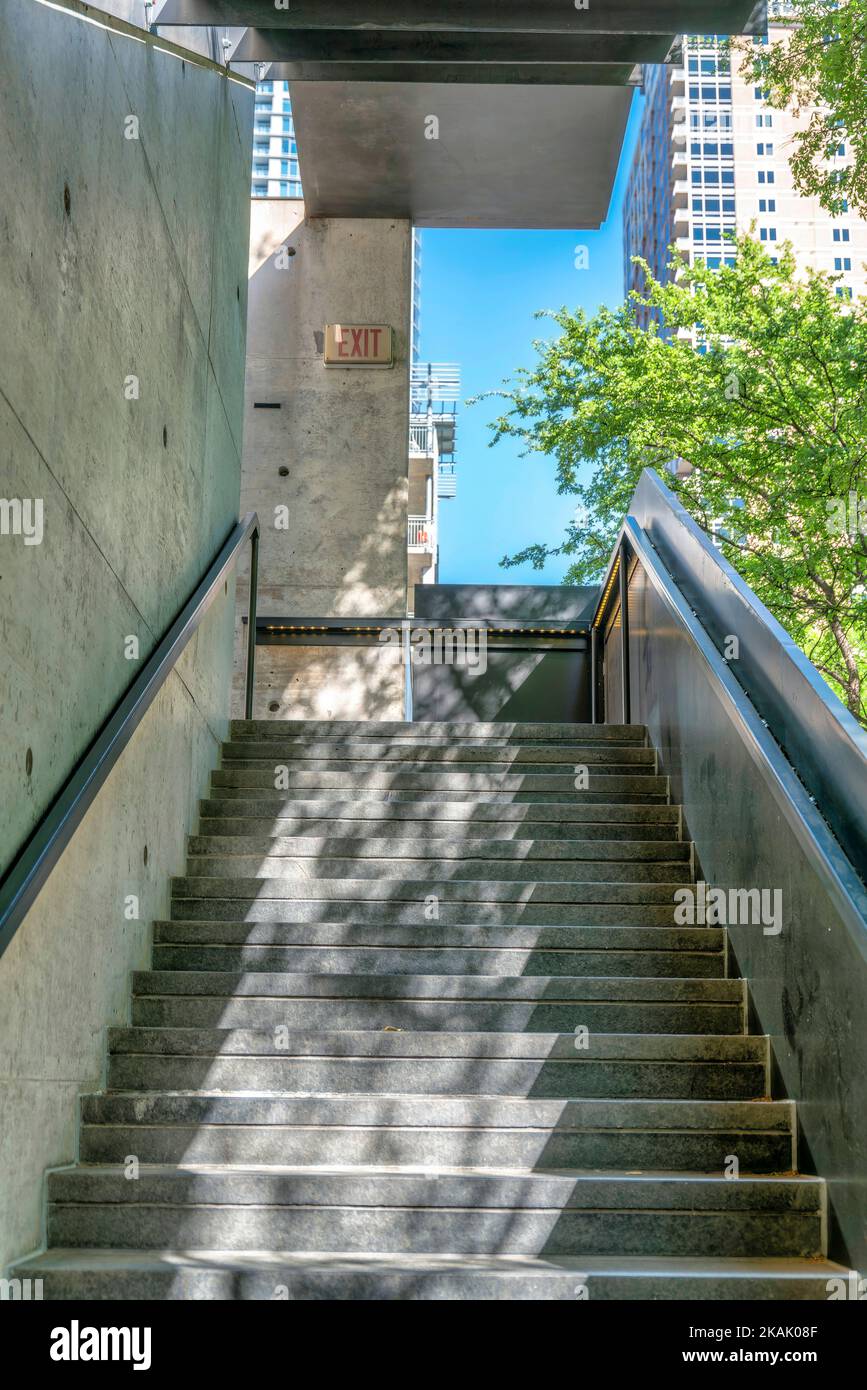 Outdoor stairway at the exterior of a building against blue sky on a ...