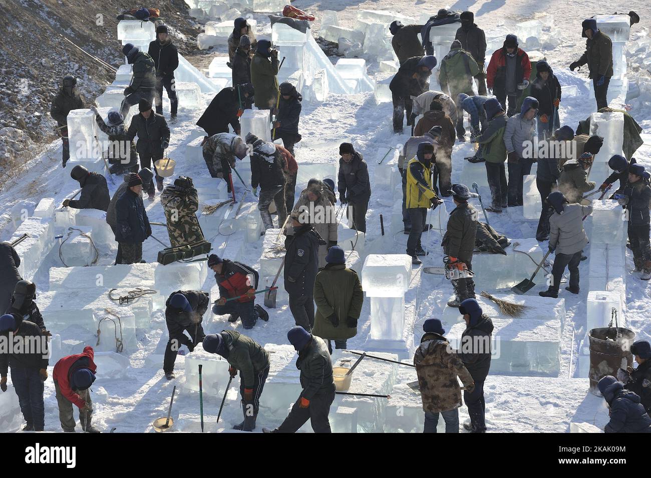 People building ice sculptures of the Harbin Ice-Snow World in Harbin ...