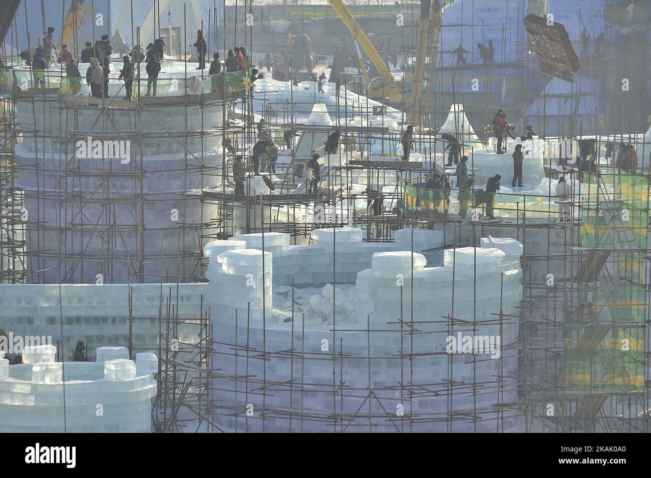 People building ice sculptures of the Harbin Ice-Snow World in Harbin ...