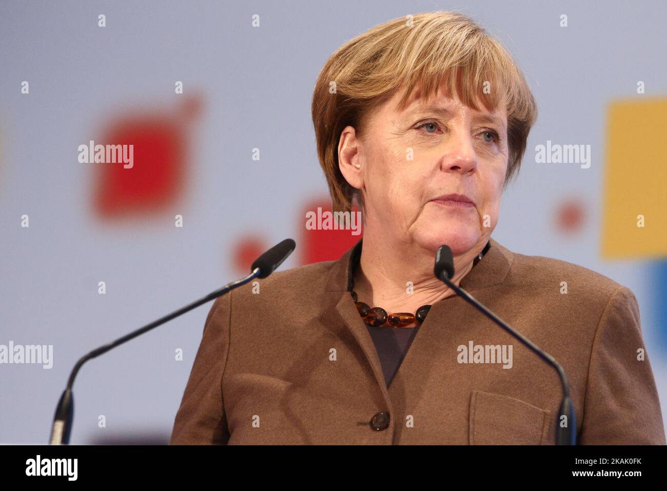 German Chancellor Angela Merkel reacts while speaking to the audience ...