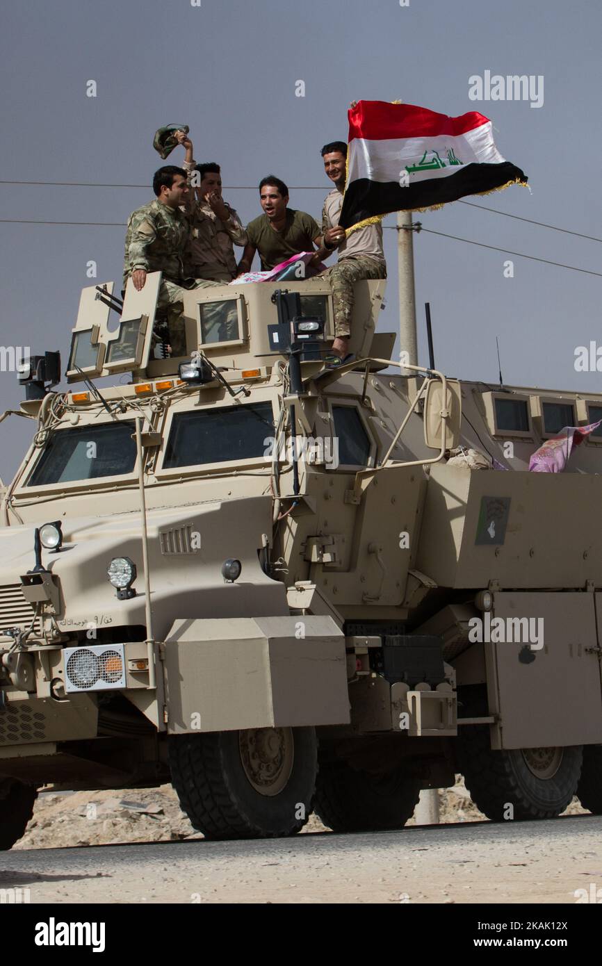 The Unit 9 of the Iraqi army is passing a crossroad in Makhmour, Iraq ...
