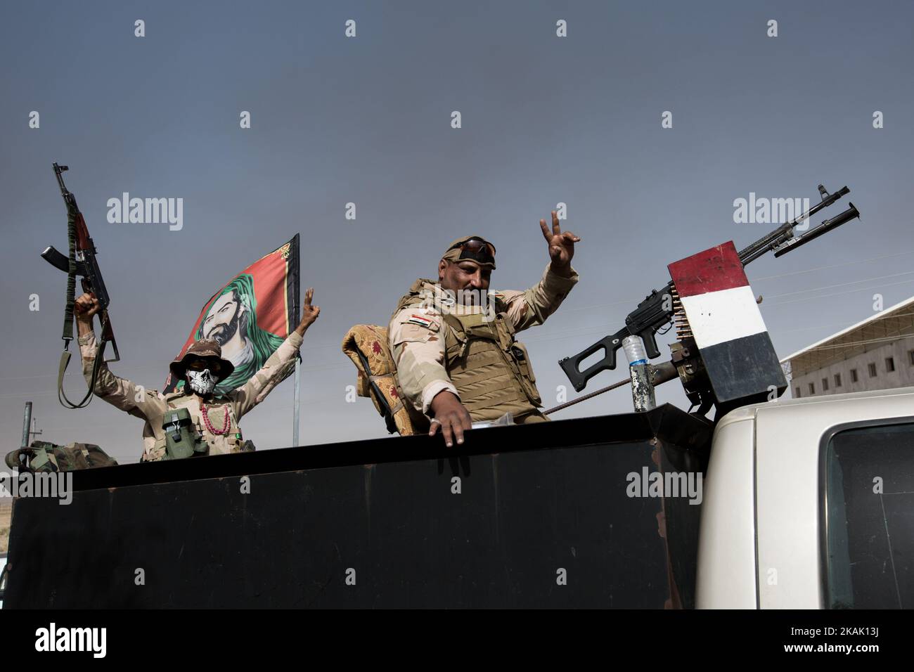 The Unit 9 of the Iraqi army is passing a crossroad in Makhmour, Iraq ...