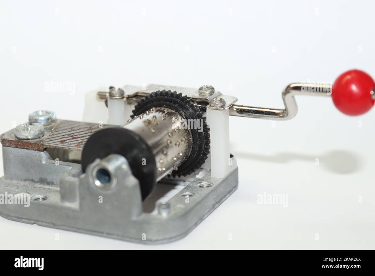 A closeup of a music box mechanism isolated on a white background Stock ...