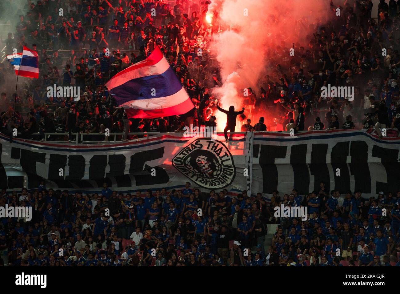 Thai football fans cheer their team during the AFF Suzuki Cup Finals ...