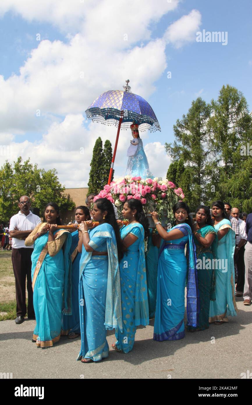 Tamil Catholics take part in the religious procession during the Feast ...