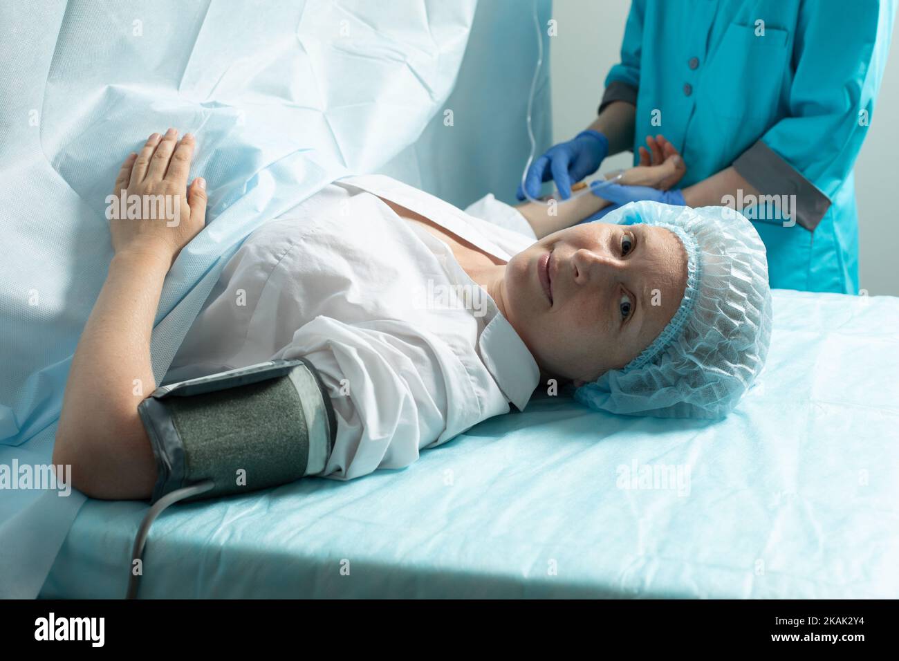 Female patient in operating room at hospital, ready to cesarean section ...