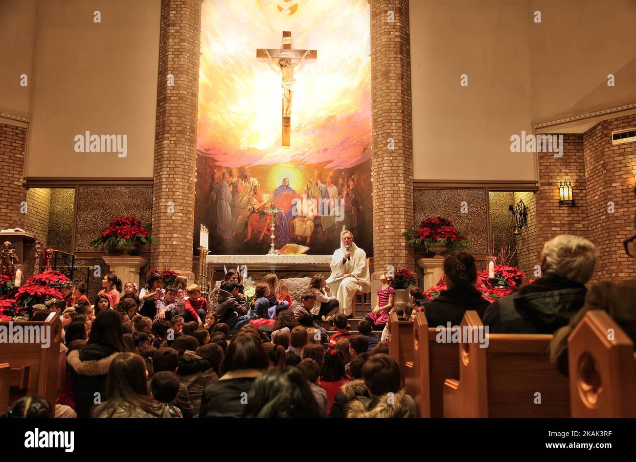 Catholic priest conducts a special children's Christmas Eve Mass at the ...