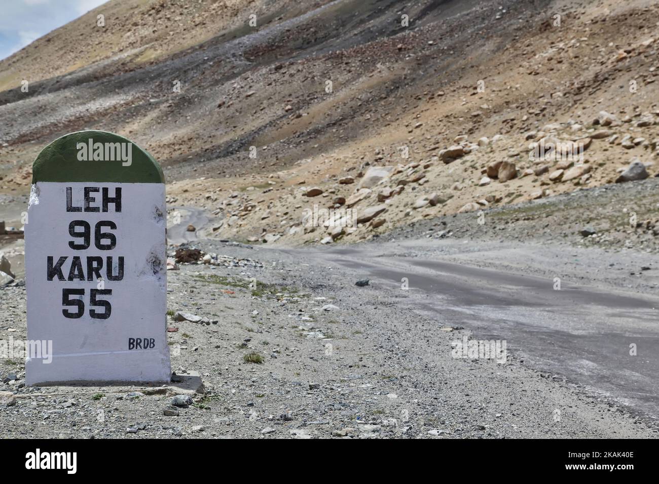 Milestone showing the distances to the town of leh and the village of ...