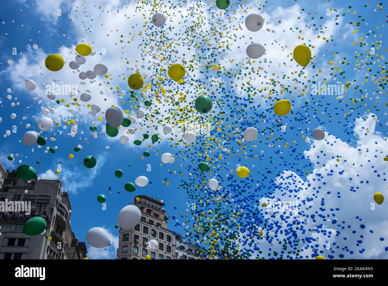 Balloons are released into the sky as part of the year-end celebrations ...