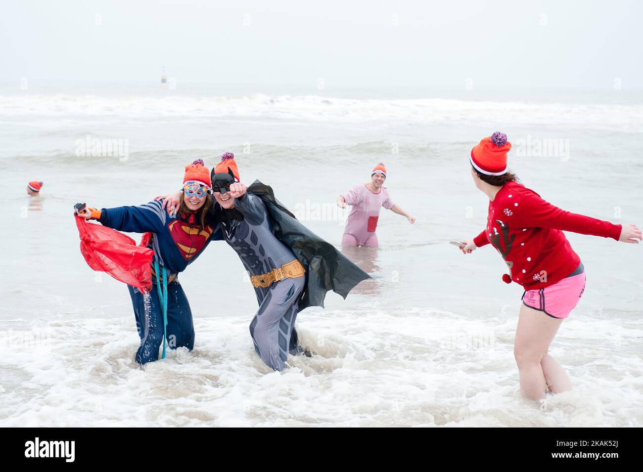 Tens of thousands of participants dip into the cold North Sea water ...