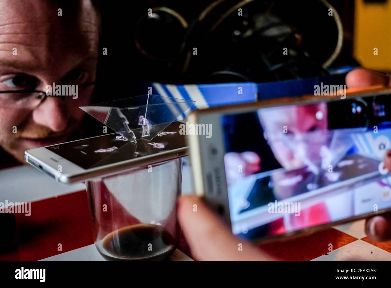 Illustration of a 3D Hologram projector with several comic strip ...