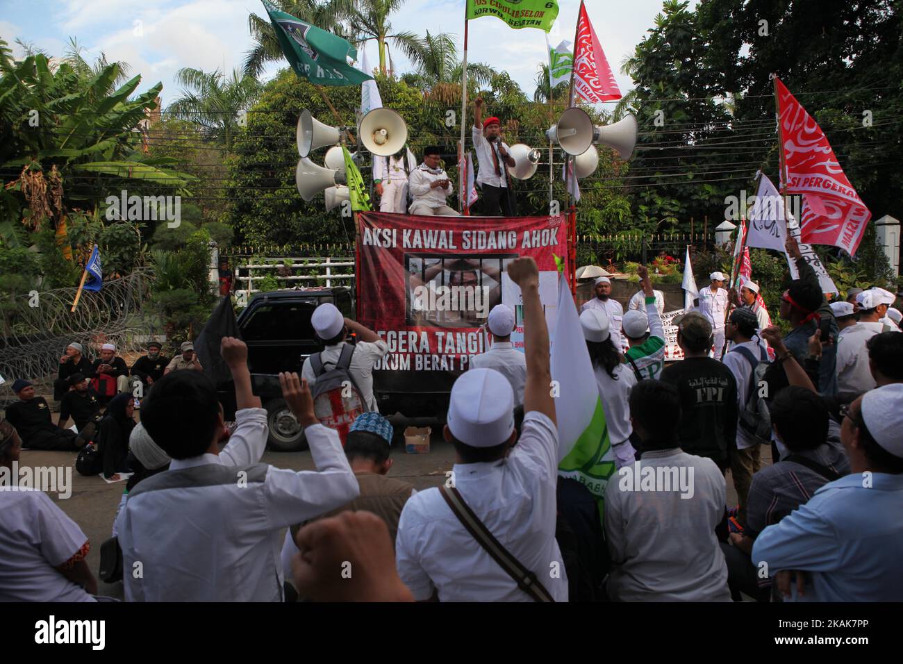Indonesian Muslims attend a demonstration outside of court, to protest ...