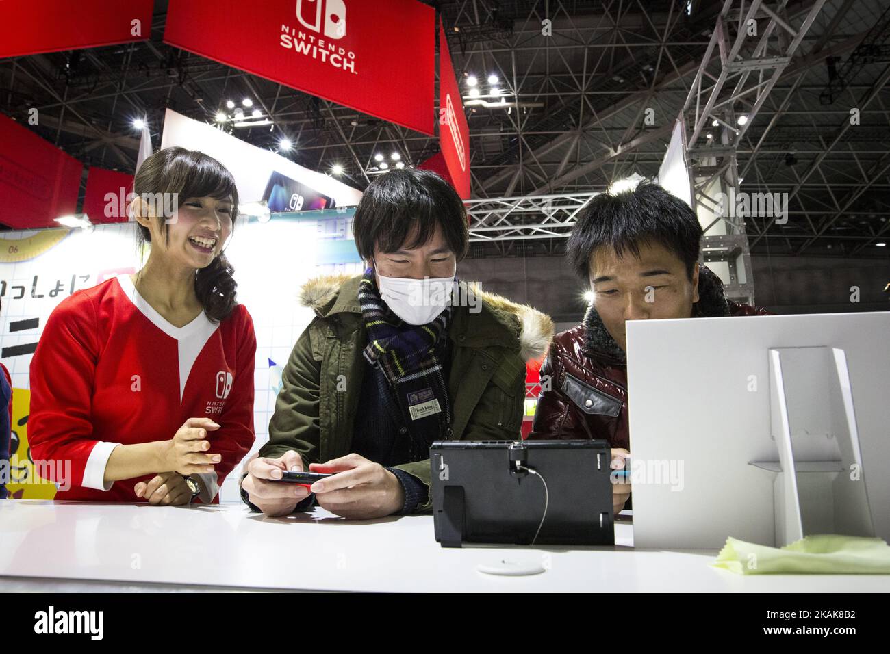 Japanese gamers trying the new game during the new console's unveiling ...
