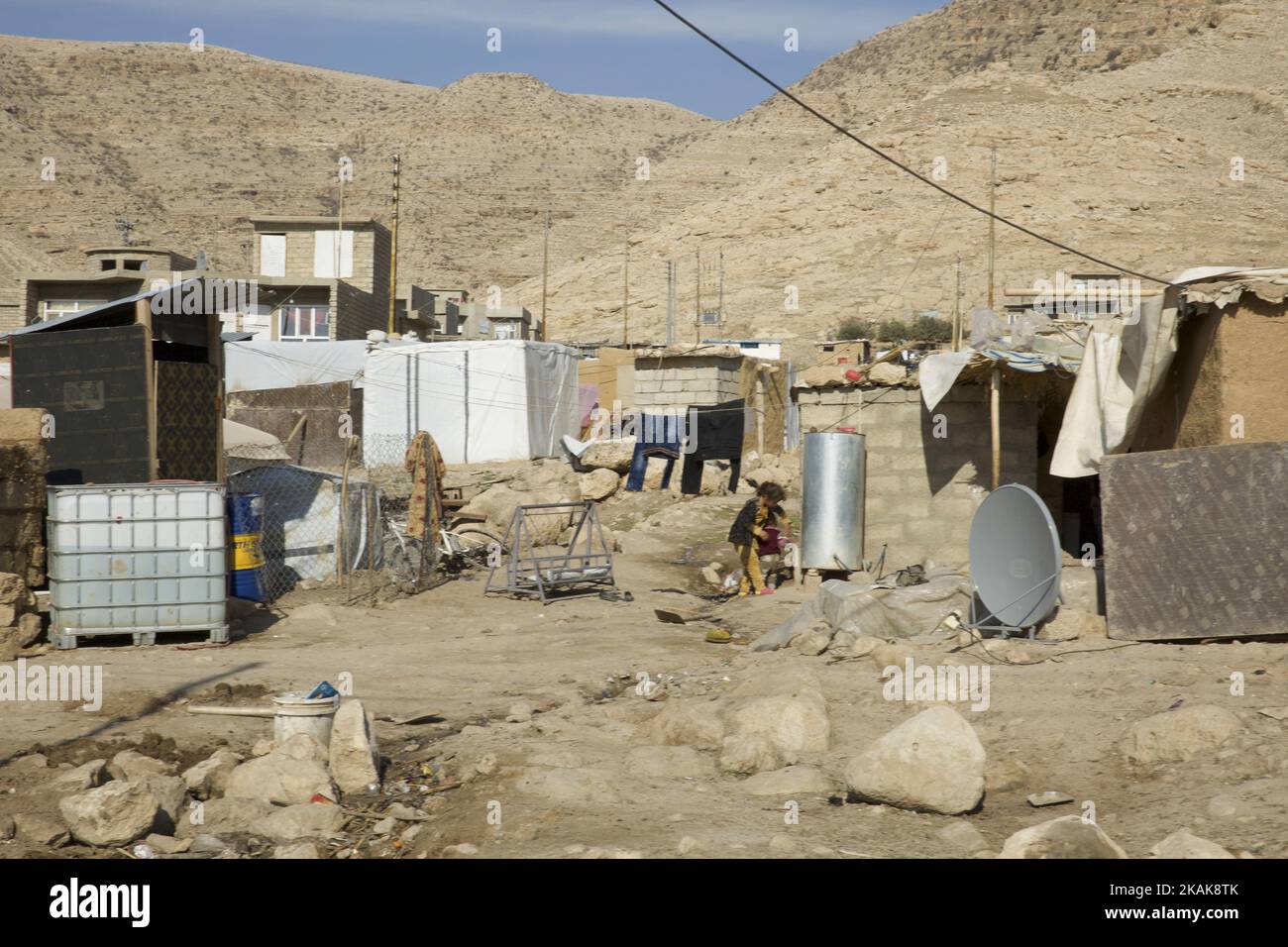 A shepherd tends his flock above the Yazidi village of Qalat Badre ...