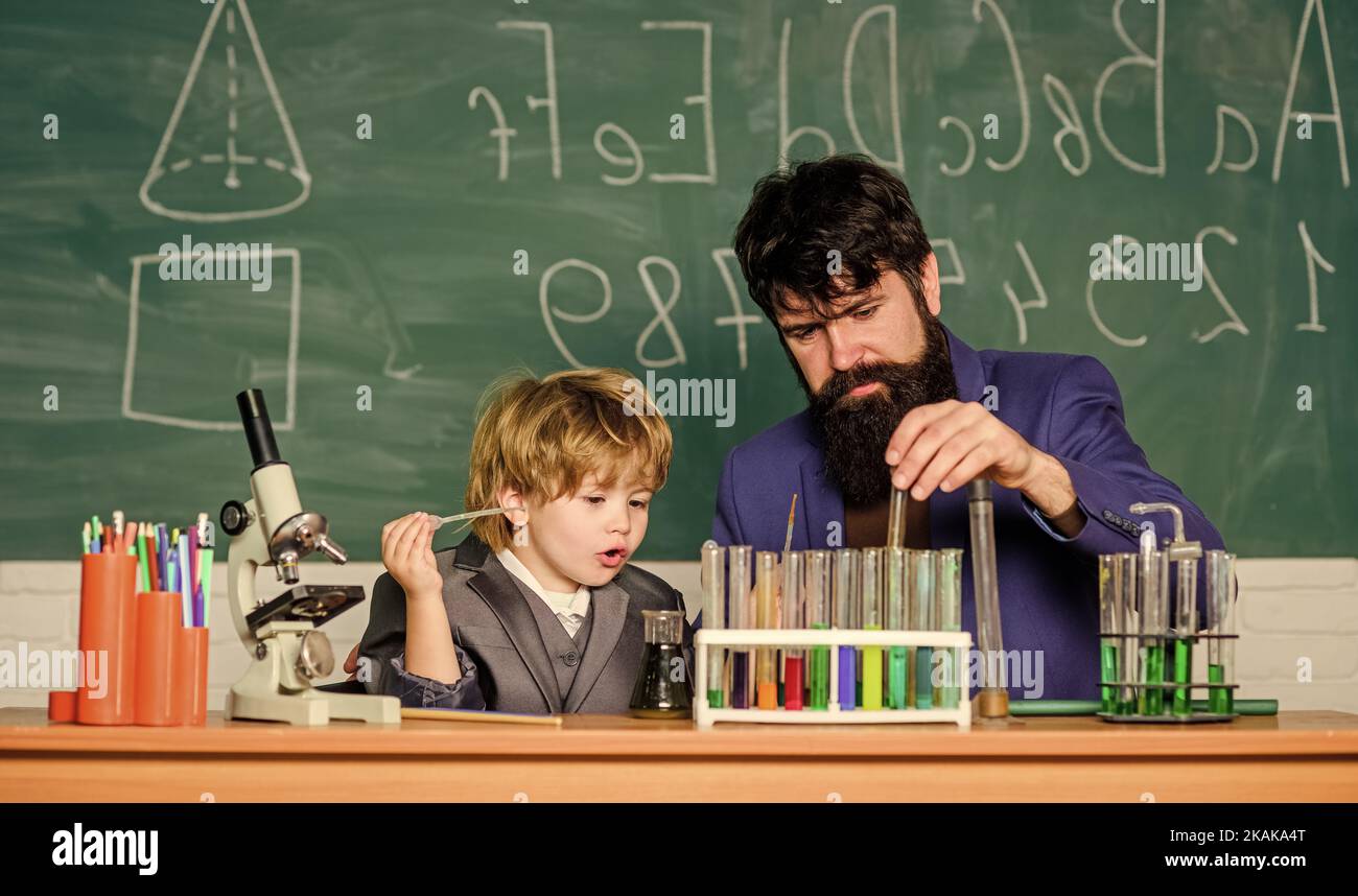 Cognitive skill. Back to school. Chemistry experiment. Teacher child ...