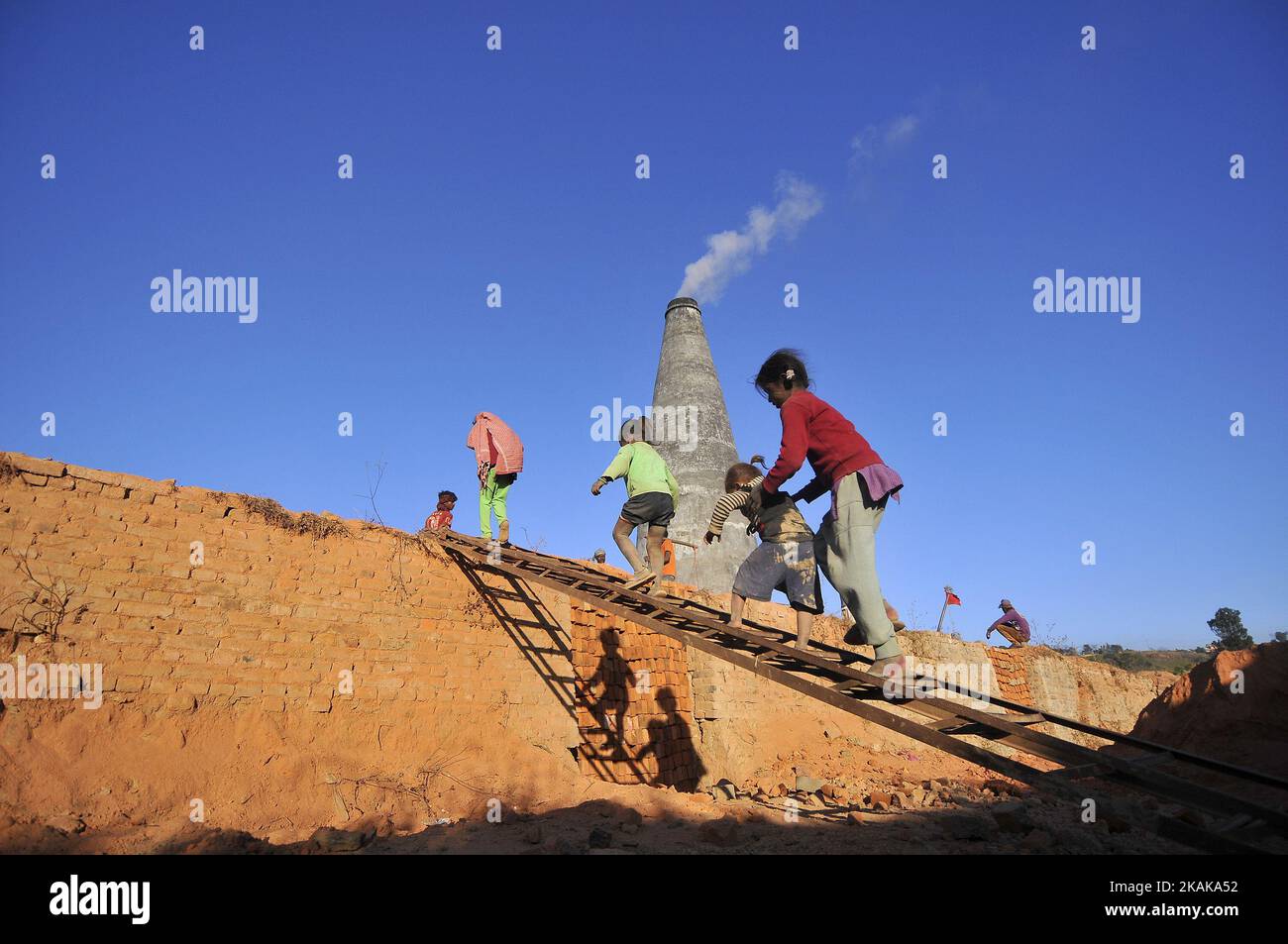 Kids playing construction workers hi-res stock photography and images ...