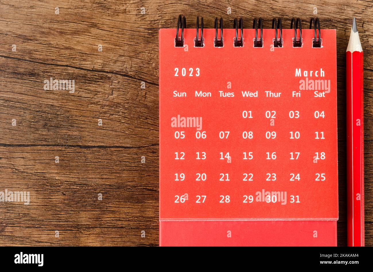 Red March 2023 Monthly desk calendar for 2023 year with pencil on ...