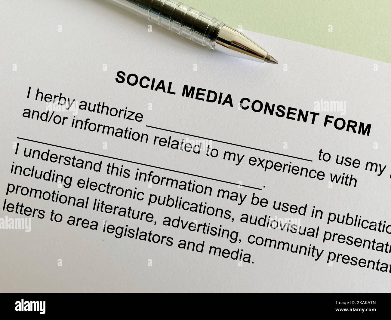 One person is reading social media consent form Stock Photo - Alamy