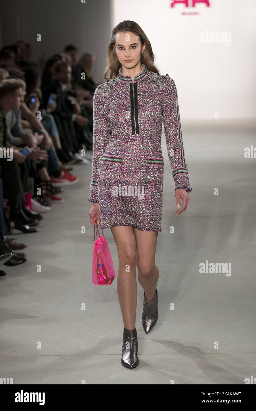 A model runs the runway at the Riani show during the Mercedes-Benz ...