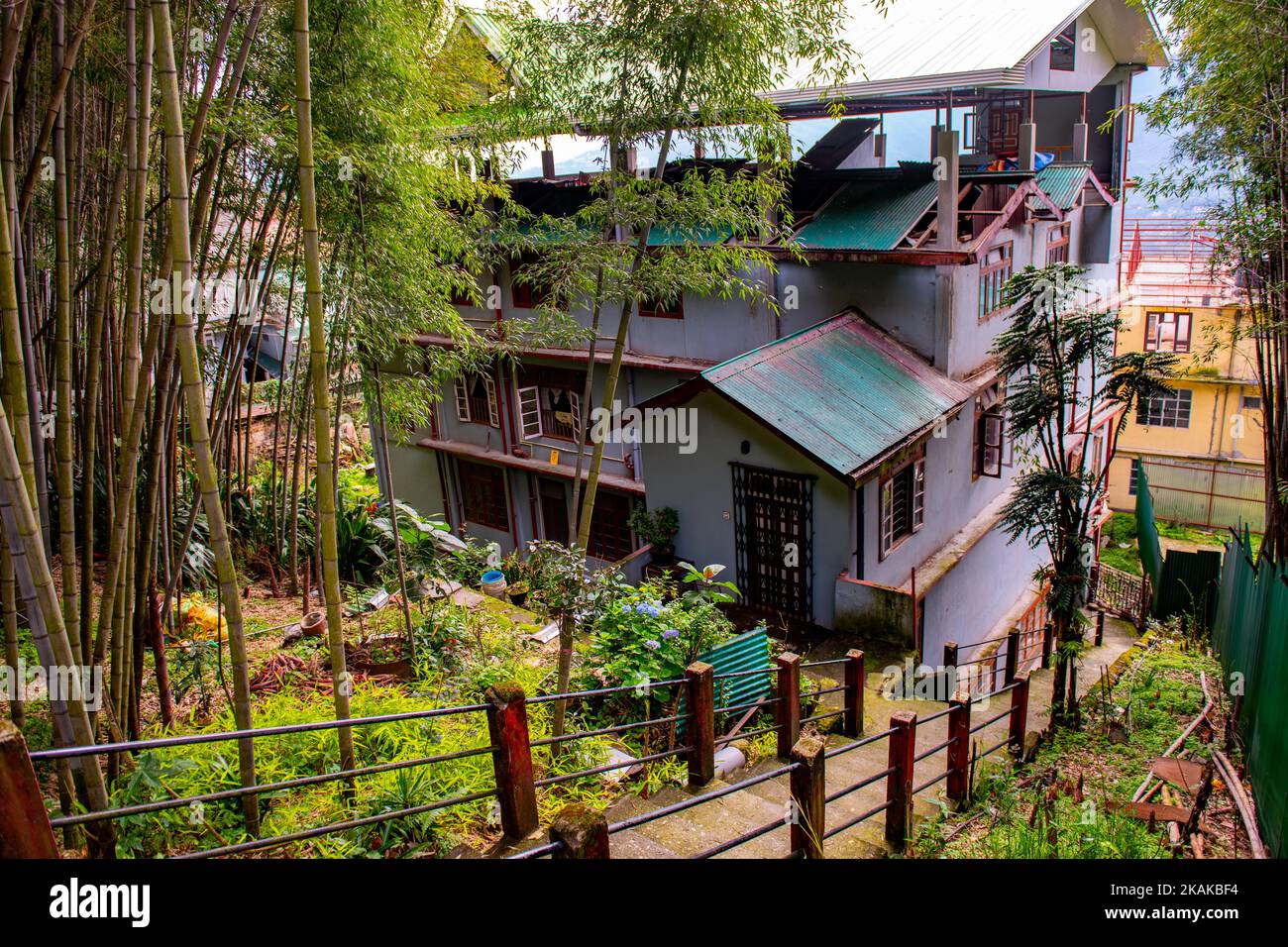 A Steep uphill walkway winding around houses in Gangtok, Sikkim, India ...
