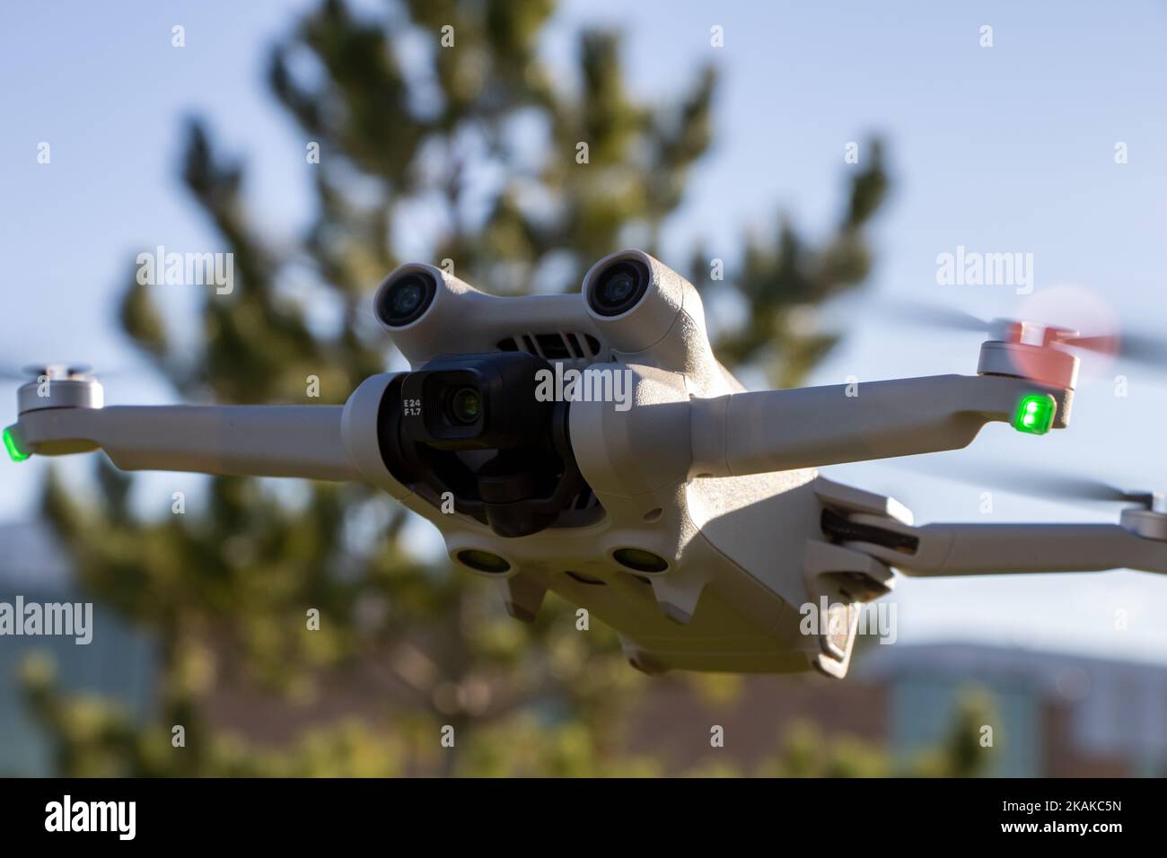 A closeup of DJI Mini 3 Pro drone flying on sunny fall day Stock Photo ...