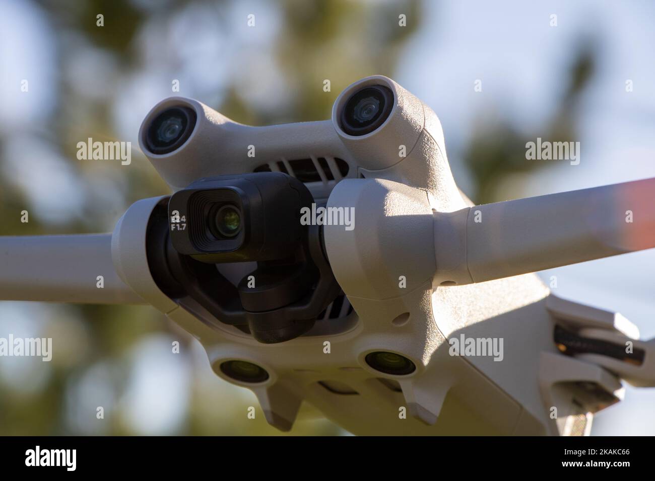 A closeup of DJI Mini 3 Pro drone flying on sunny fall day Stock Photo ...