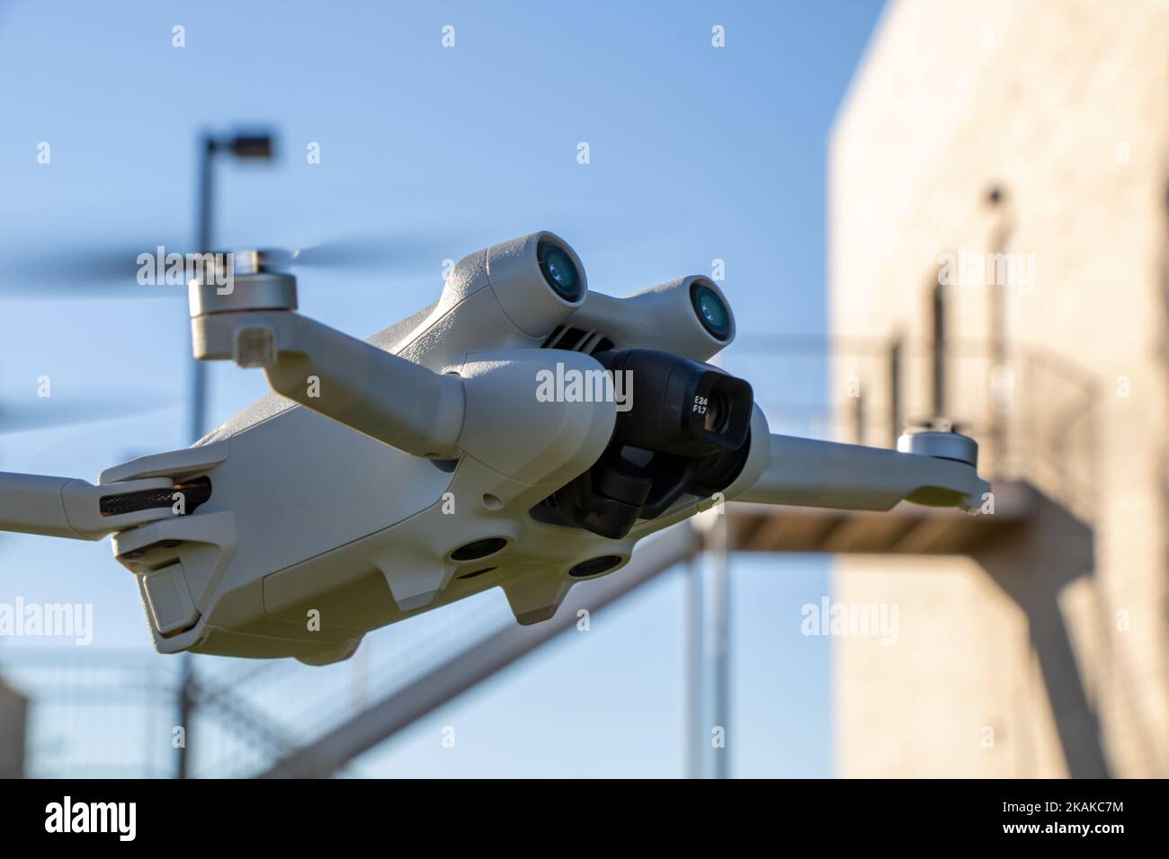 A closeup of DJI Mini 3 Pro drone flying on sunny fall day Stock Photo ...