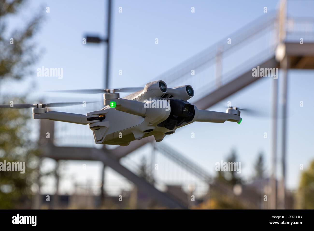 A closeup of DJI Mini 3 Pro drone flying on sunny fall day Stock Photo ...