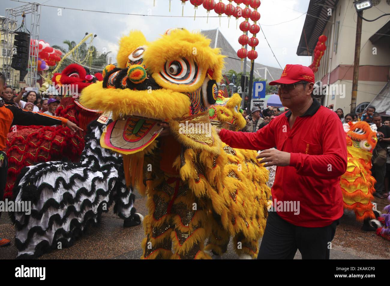 Participant wear a chinese traditioal costume and perform the Lion ...