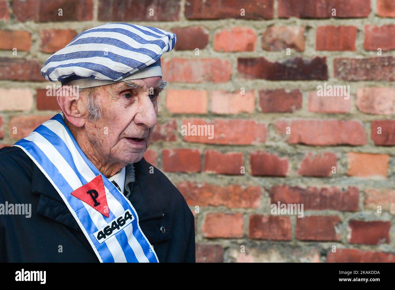 Auschwitz survivor Miroslaw Celka walks out the gate after paying ...