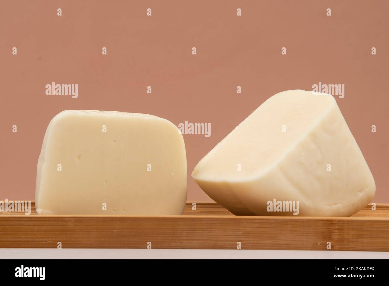 Minas half-cured cheese on a bamboo tray in a neutral background Stock ...