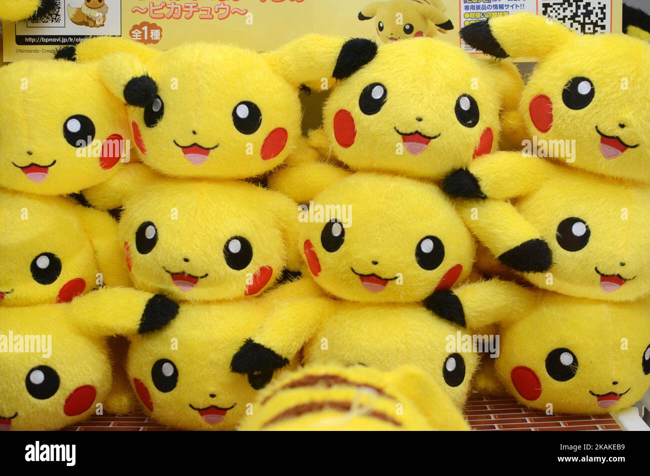 Stuffed Pikachu toys, a Pokemon fictional character, are stacked in a ...