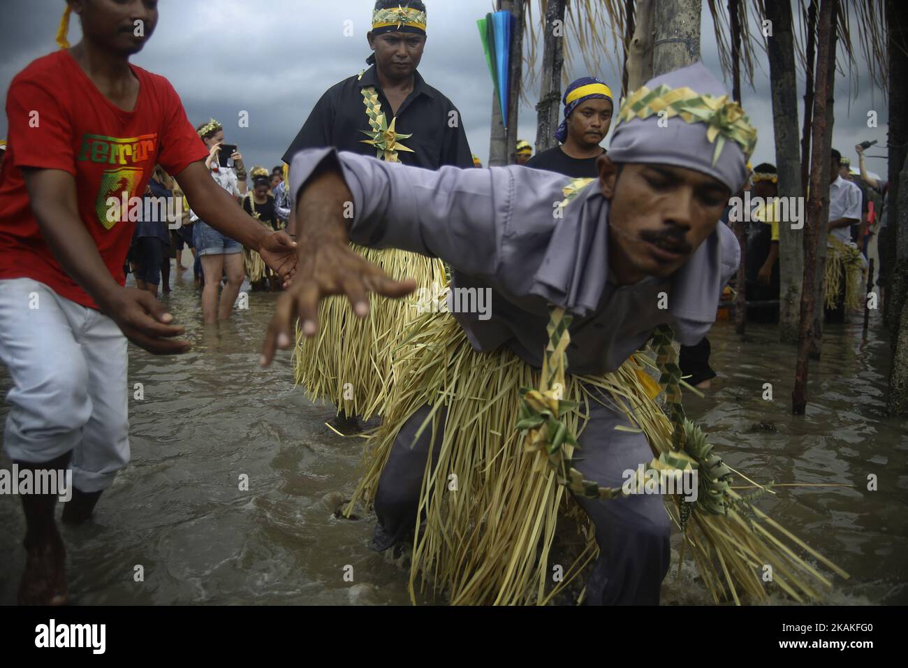 Shaman of the Mah Meri tribe performs prayers on the beach as they ...