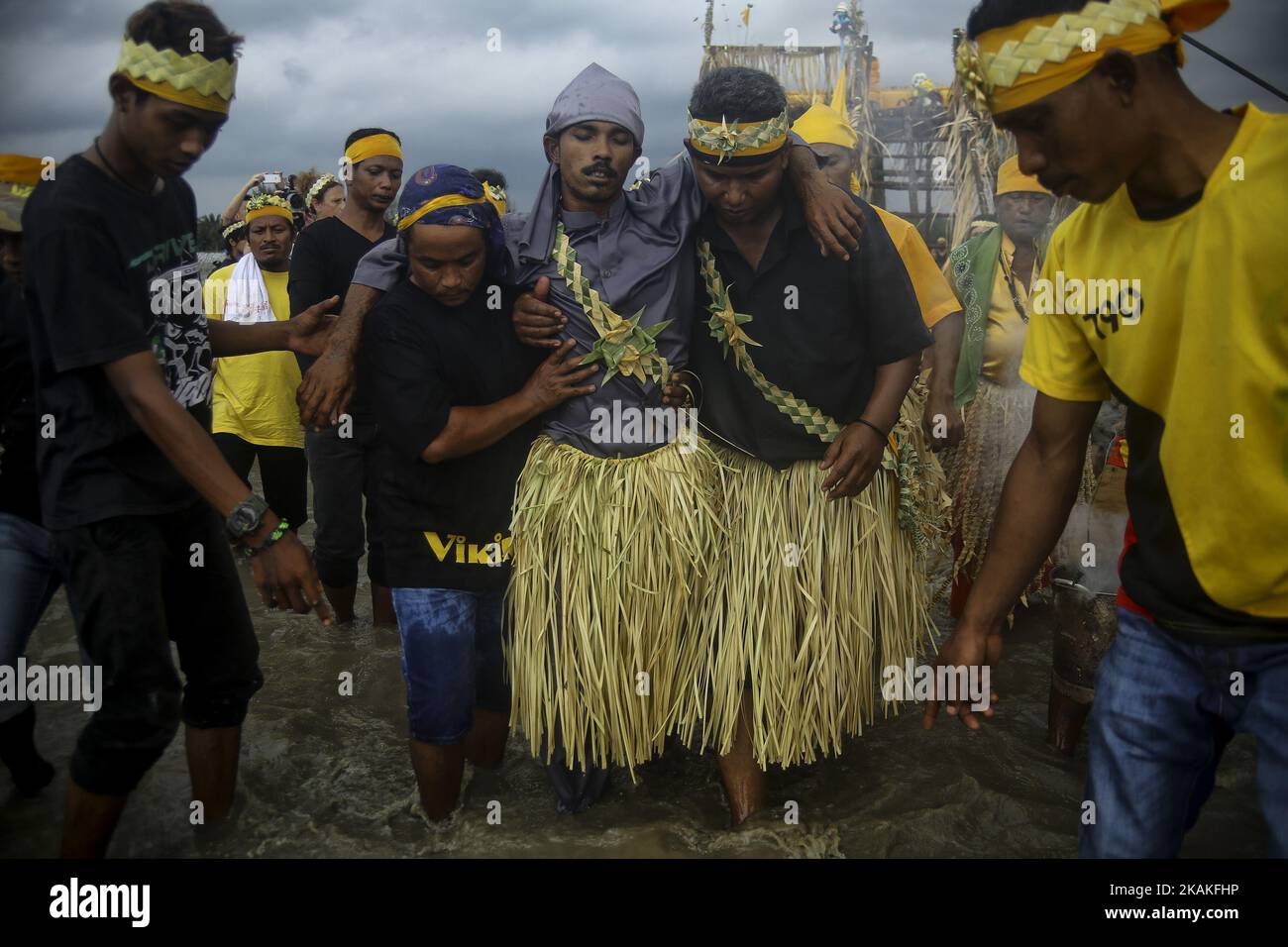A man of the Mah Meri tribe wearing a traditional cloth performs ...