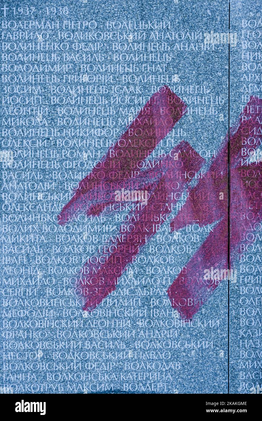 SS Nazi symbol painted on a memorial stone at the Bykivnia cemetery ...