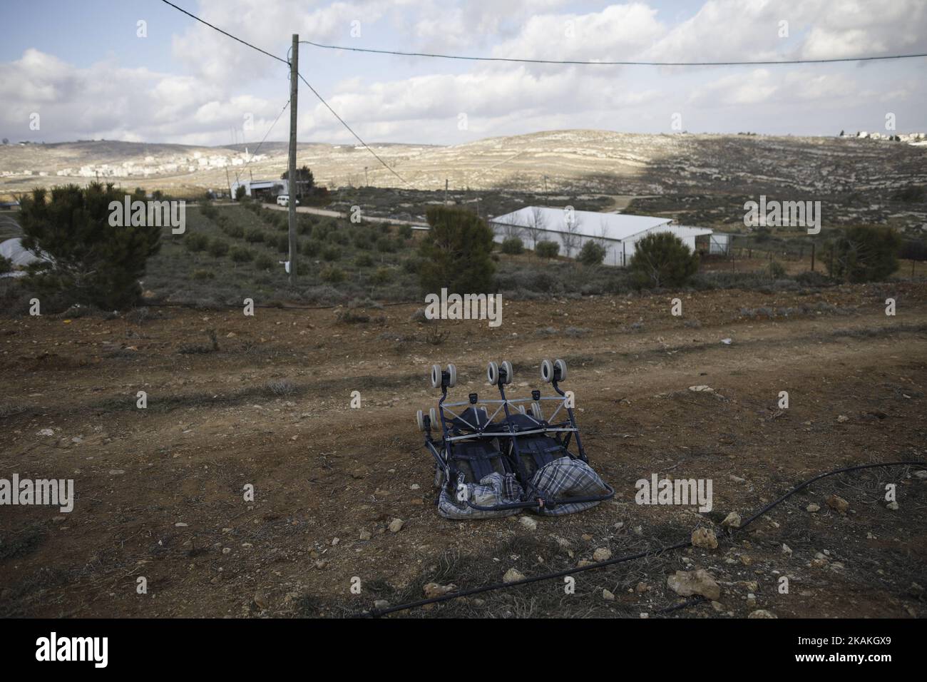 A buggy is seen upside down during an operation by Israeli forces to ...