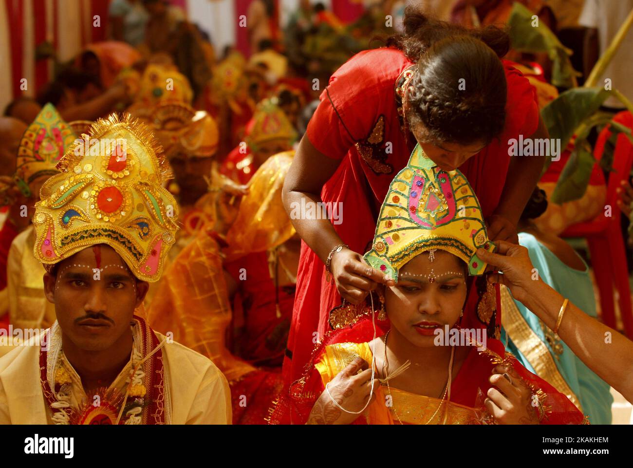 Bride and Grooms from below poverty line sits in the marriage rituals ...